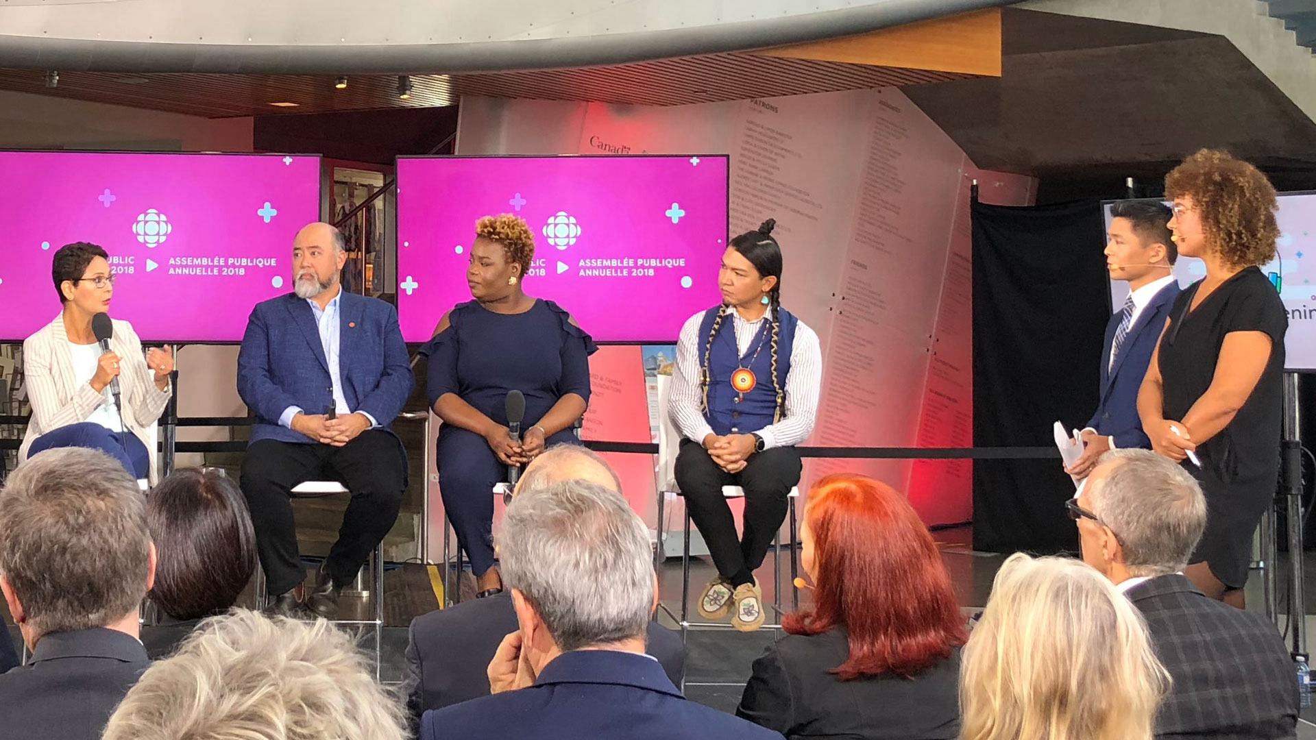 Group discussing in front of a public