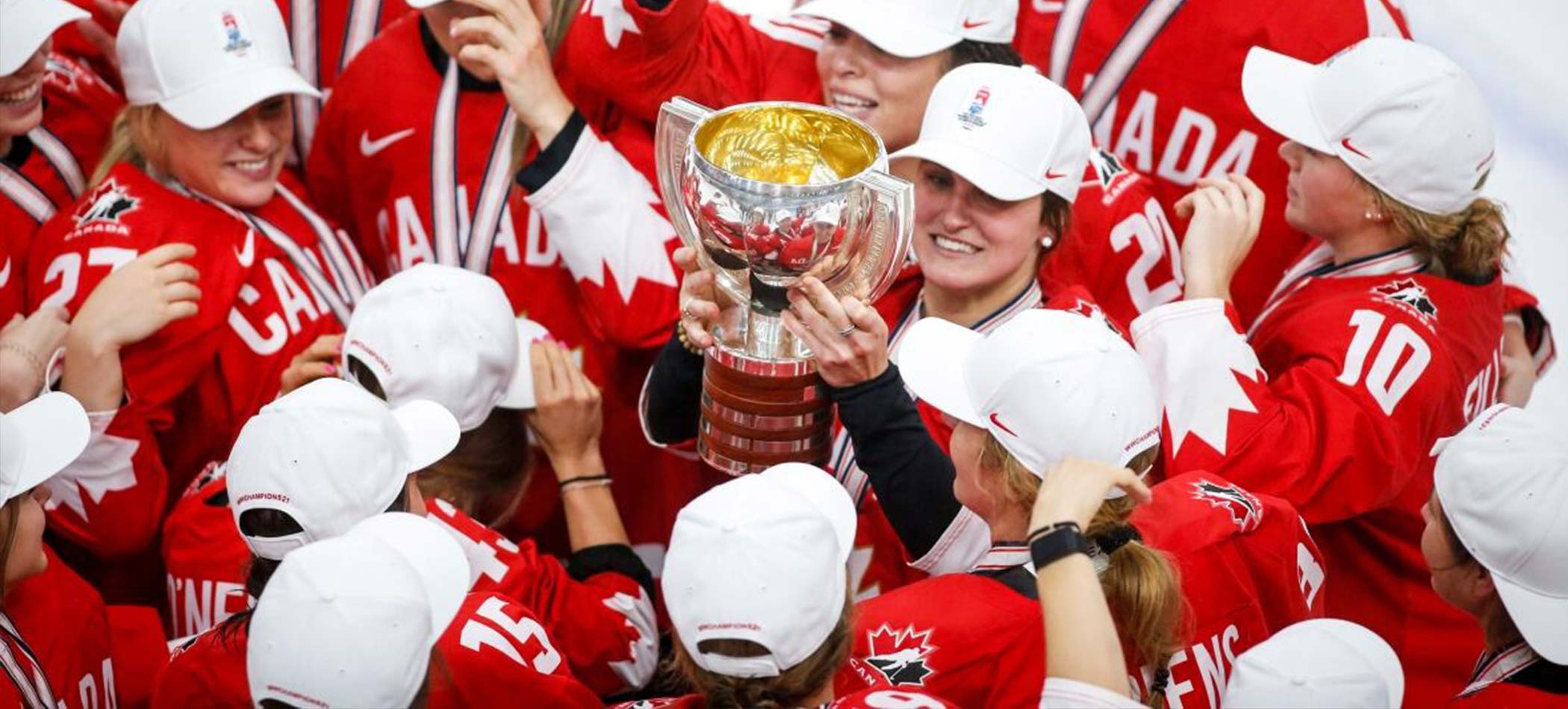 The Canadian Olympic female hockey team huddled in a circle celebrating ...
