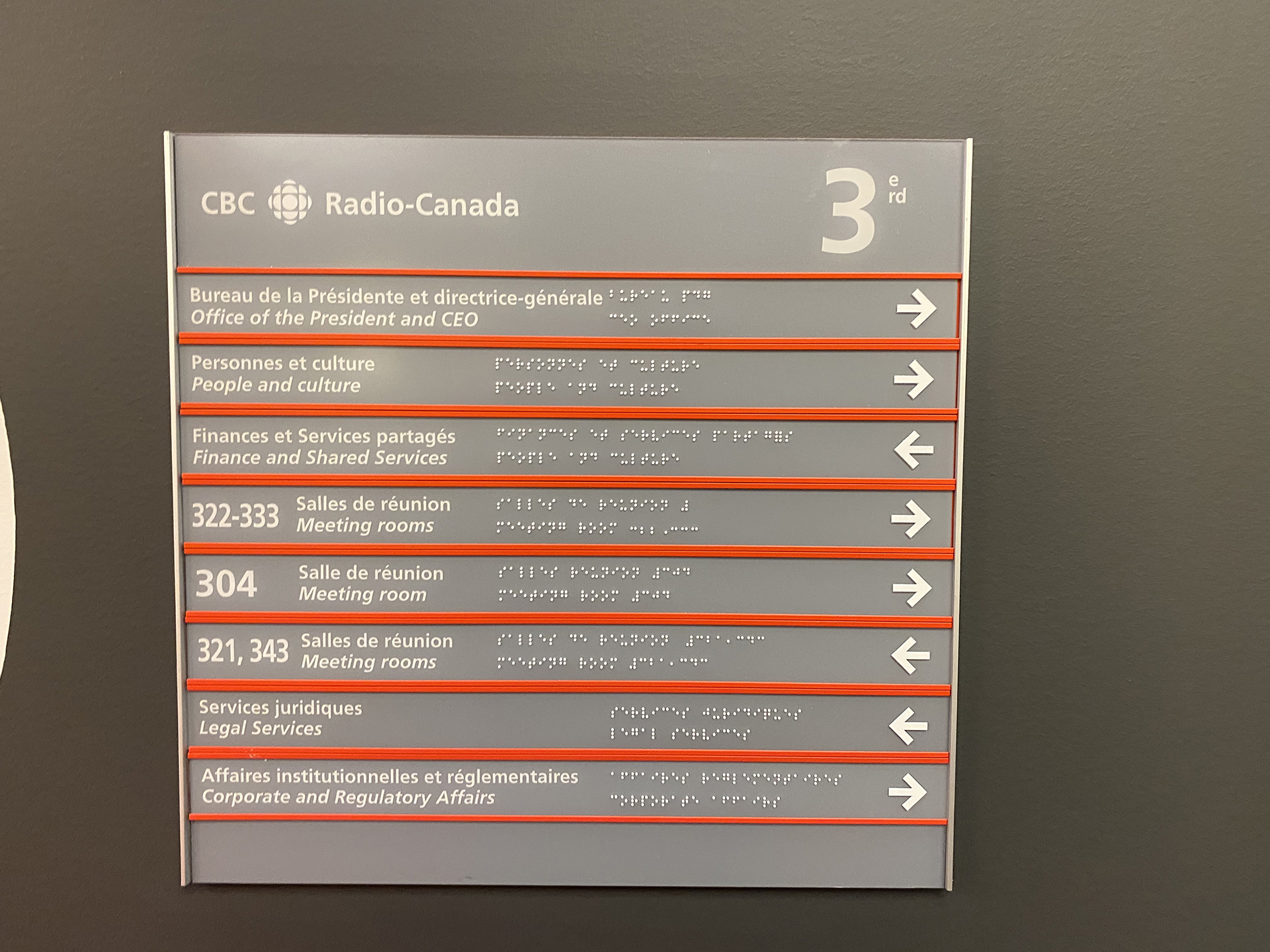 Third floor signage beside the elevator with braille instructions