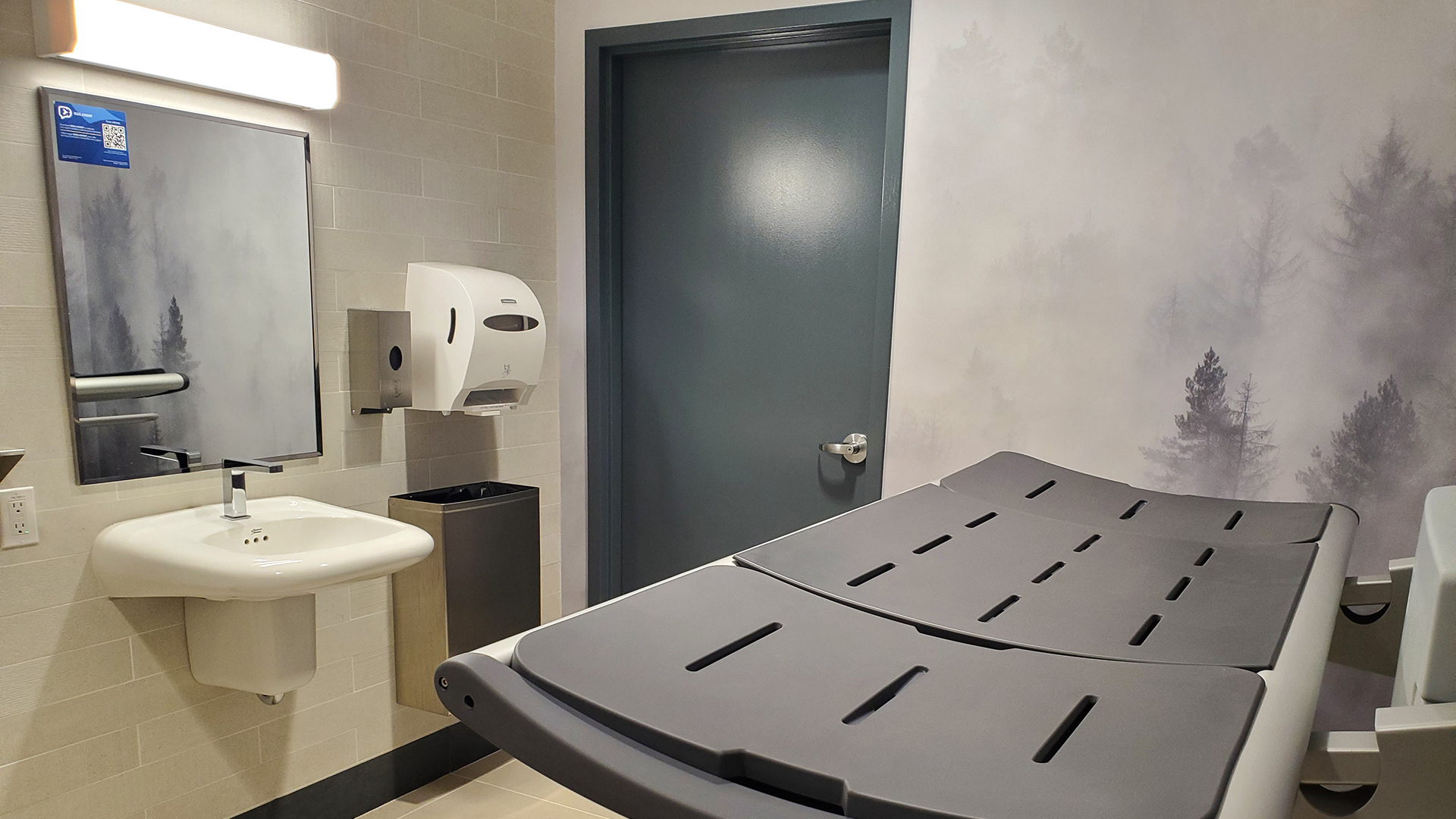 Interior of a universal washroom with an adult-sized change table ...